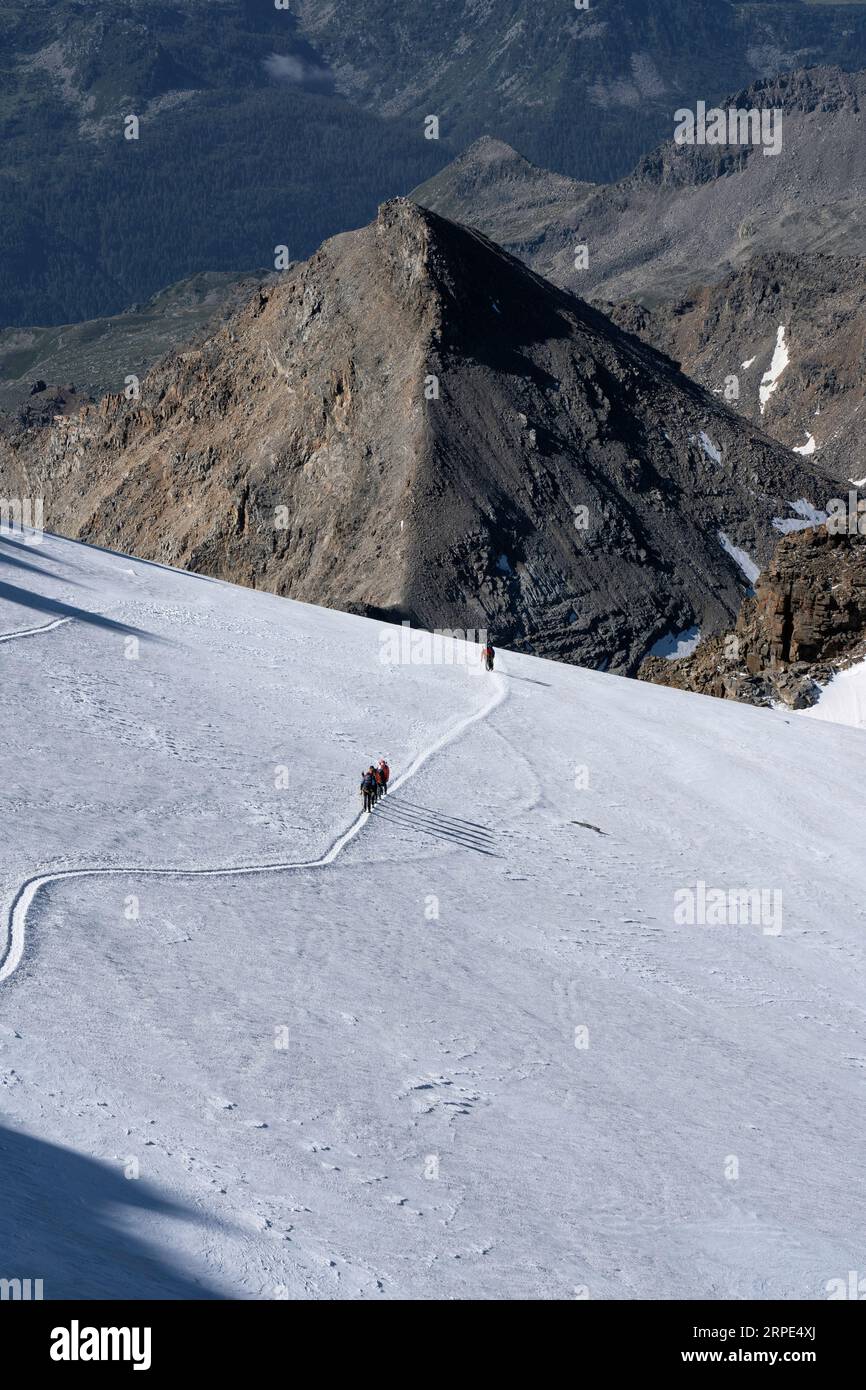 Mountaineers climbing Gran Paradiso glacier to the summit of the ...