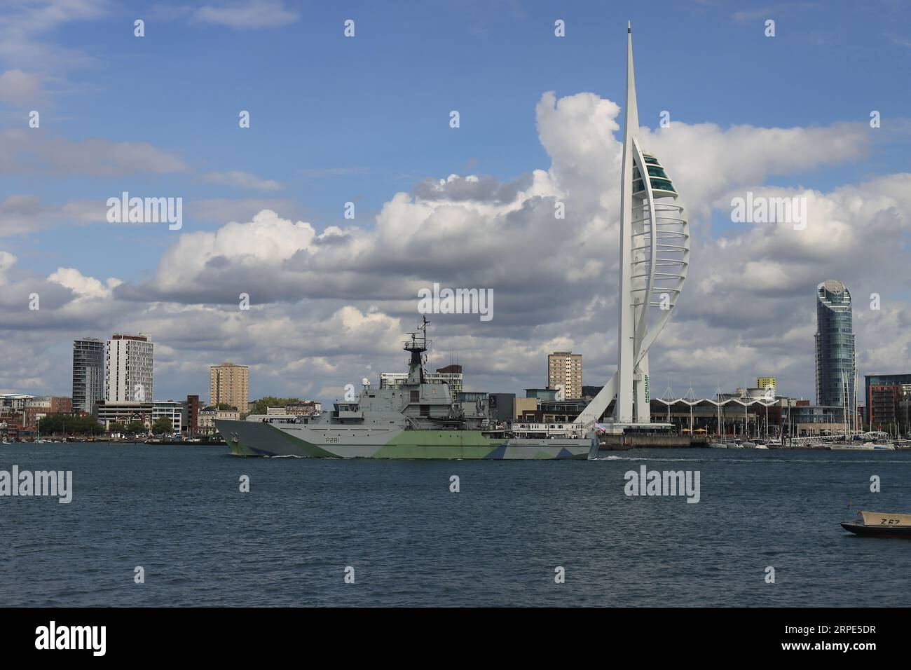 Passing the Spinnaker Tower as she sails towards her harbour berth: HMS ...
