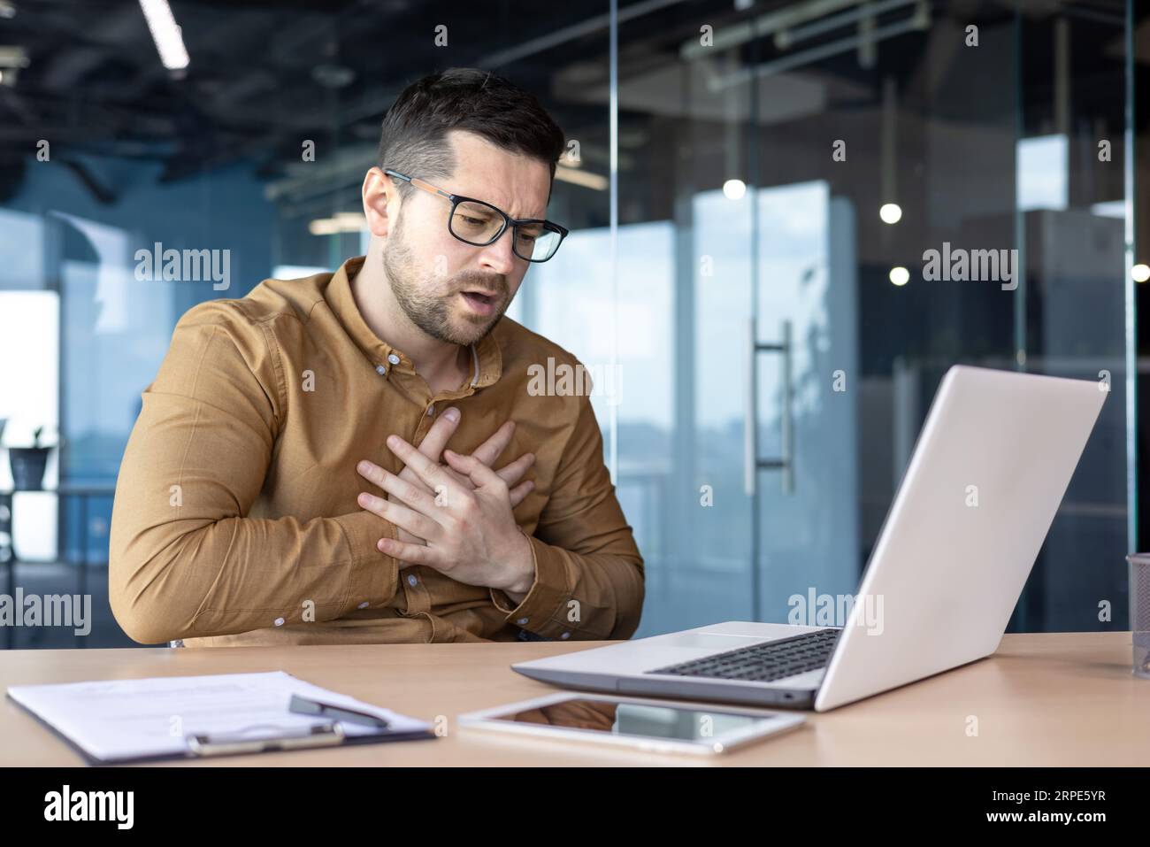 Stroke, heart attack, panic attack at the workplace. A young office ...