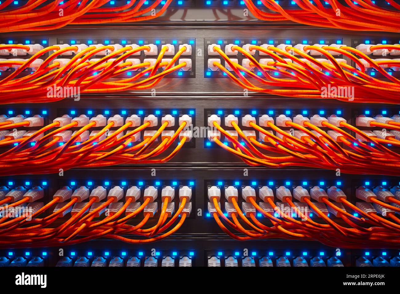 Countless orange cables in a metal server cabinet lit by a single ...