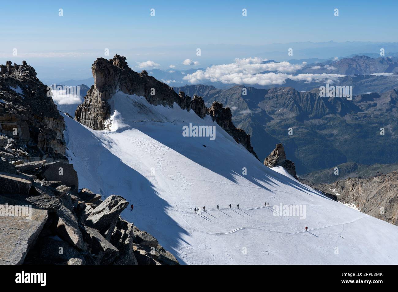 Mountaineers climbing Gran Paradiso glacier to the summit of the ...