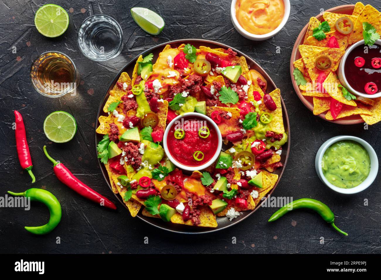Loaded nachos. Mexican nacho chips with beef, overhead flat lay shot ...