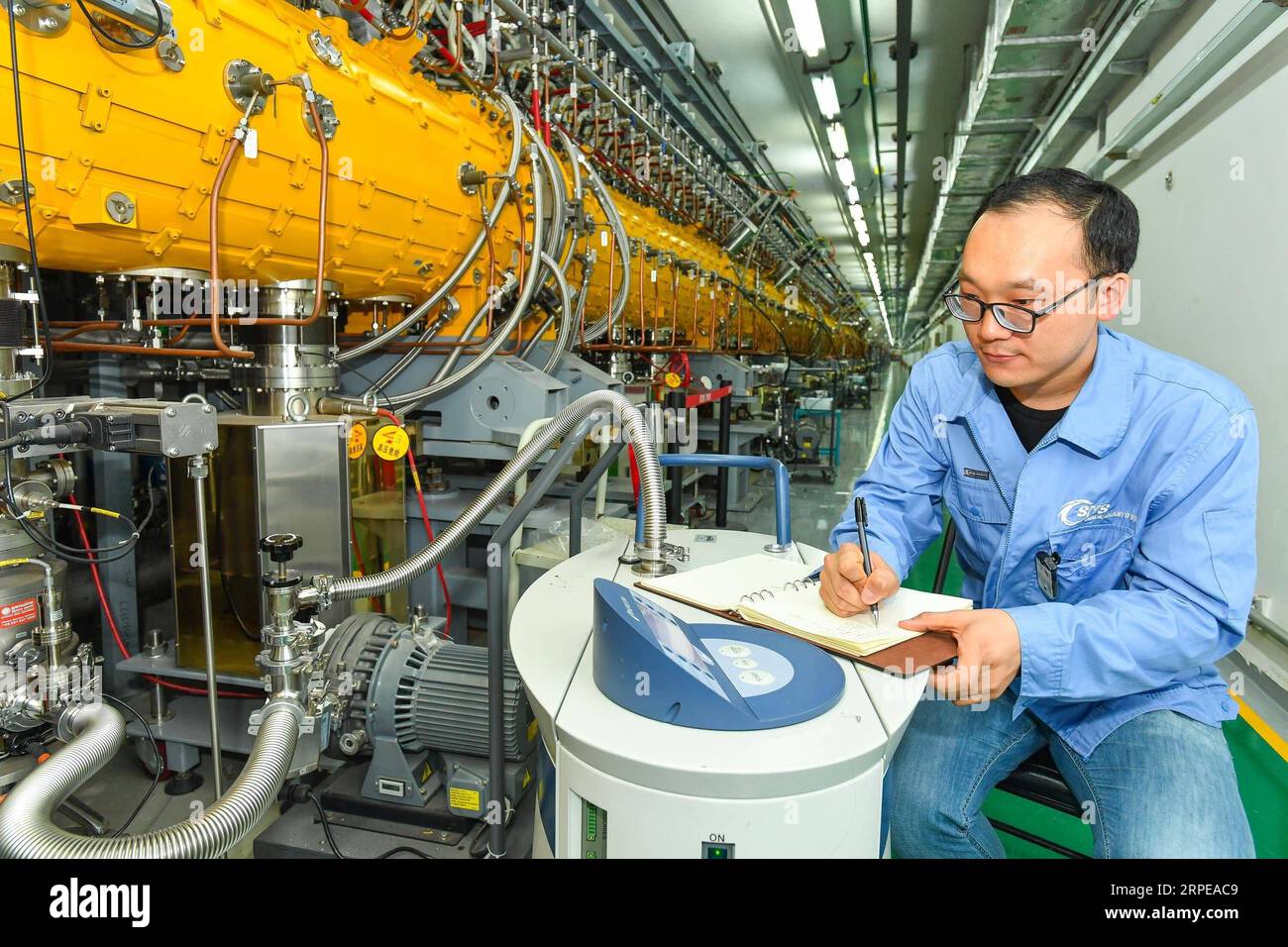 (190823) -- GUANGZHOU, Aug. 23, 2019 -- An operator checks the Linac ...