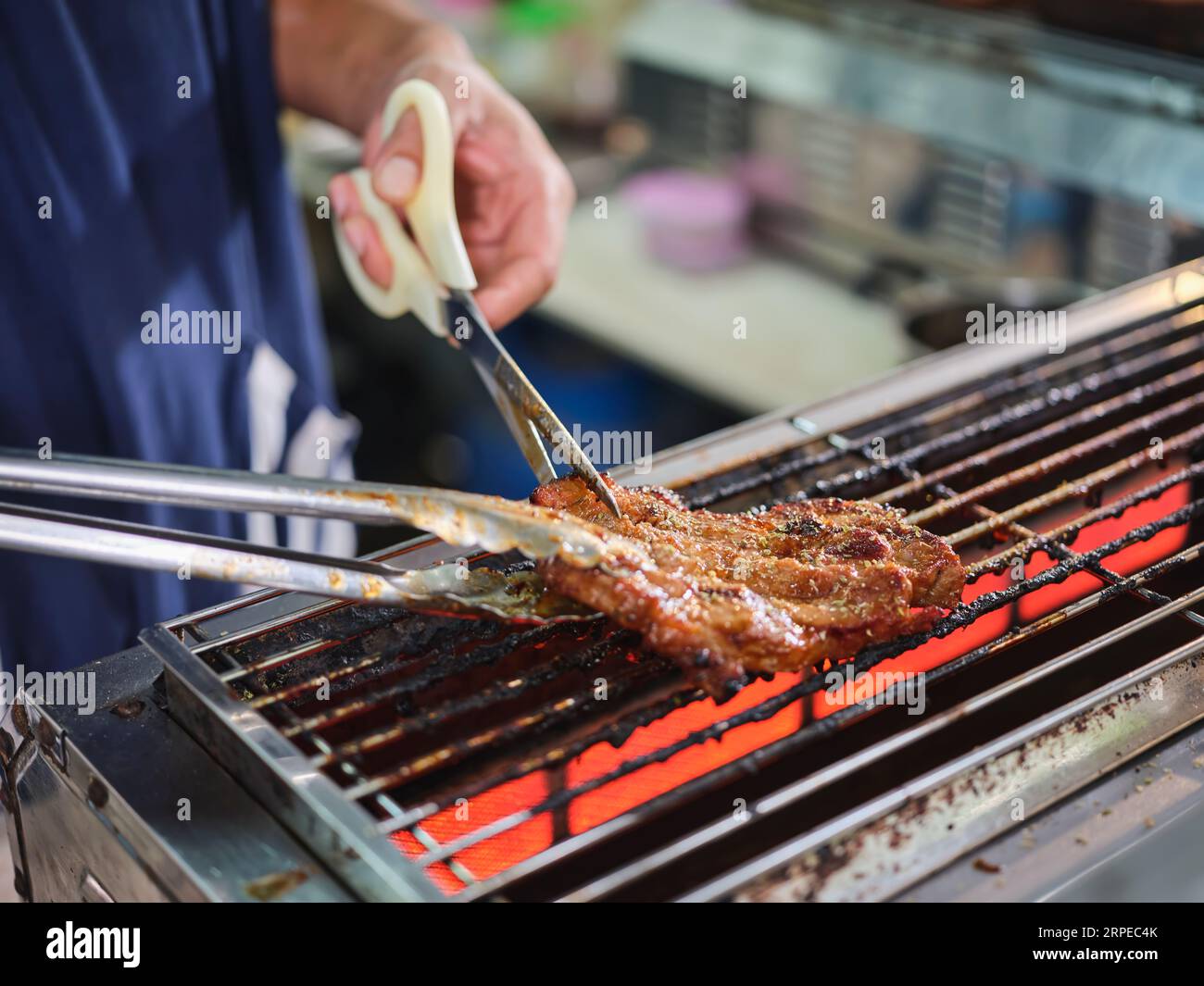 Man grills meat hi-res stock photography and images - Alamy