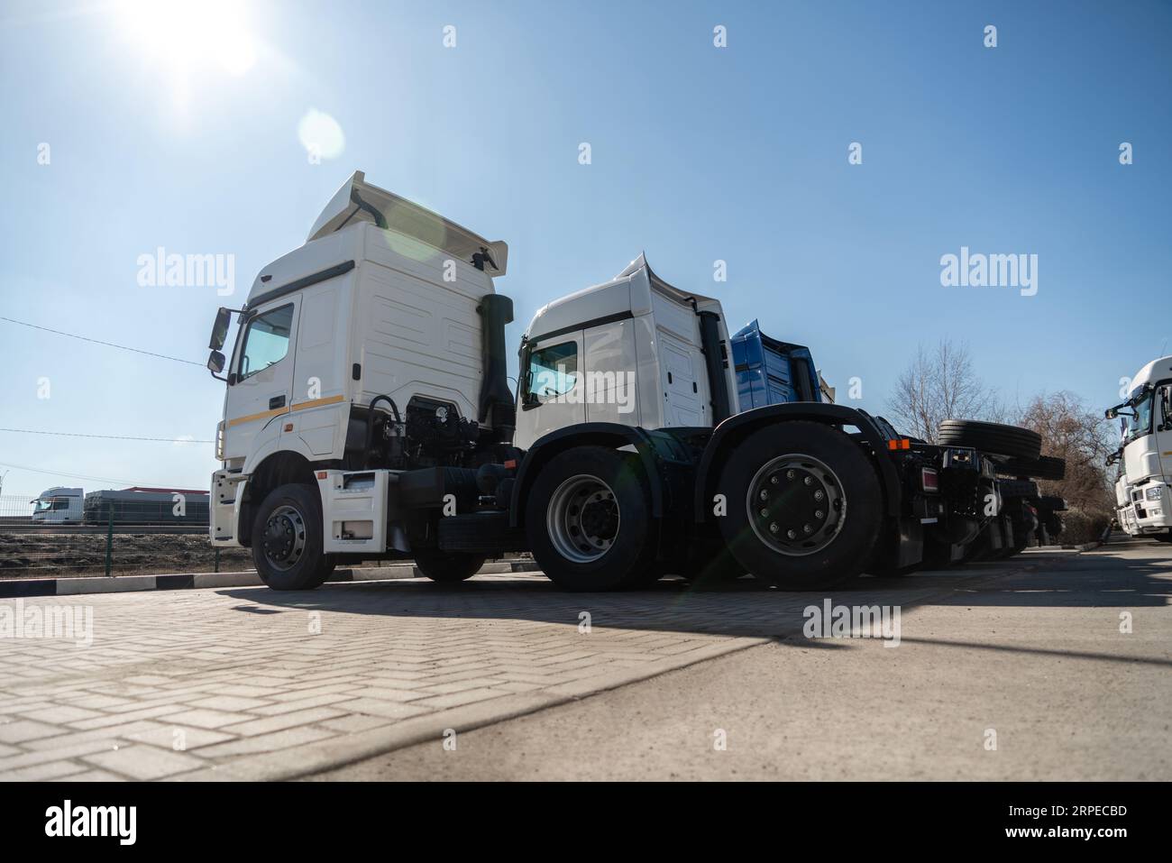 Semi truck fleet at the logistics center Stock Photo - Alamy