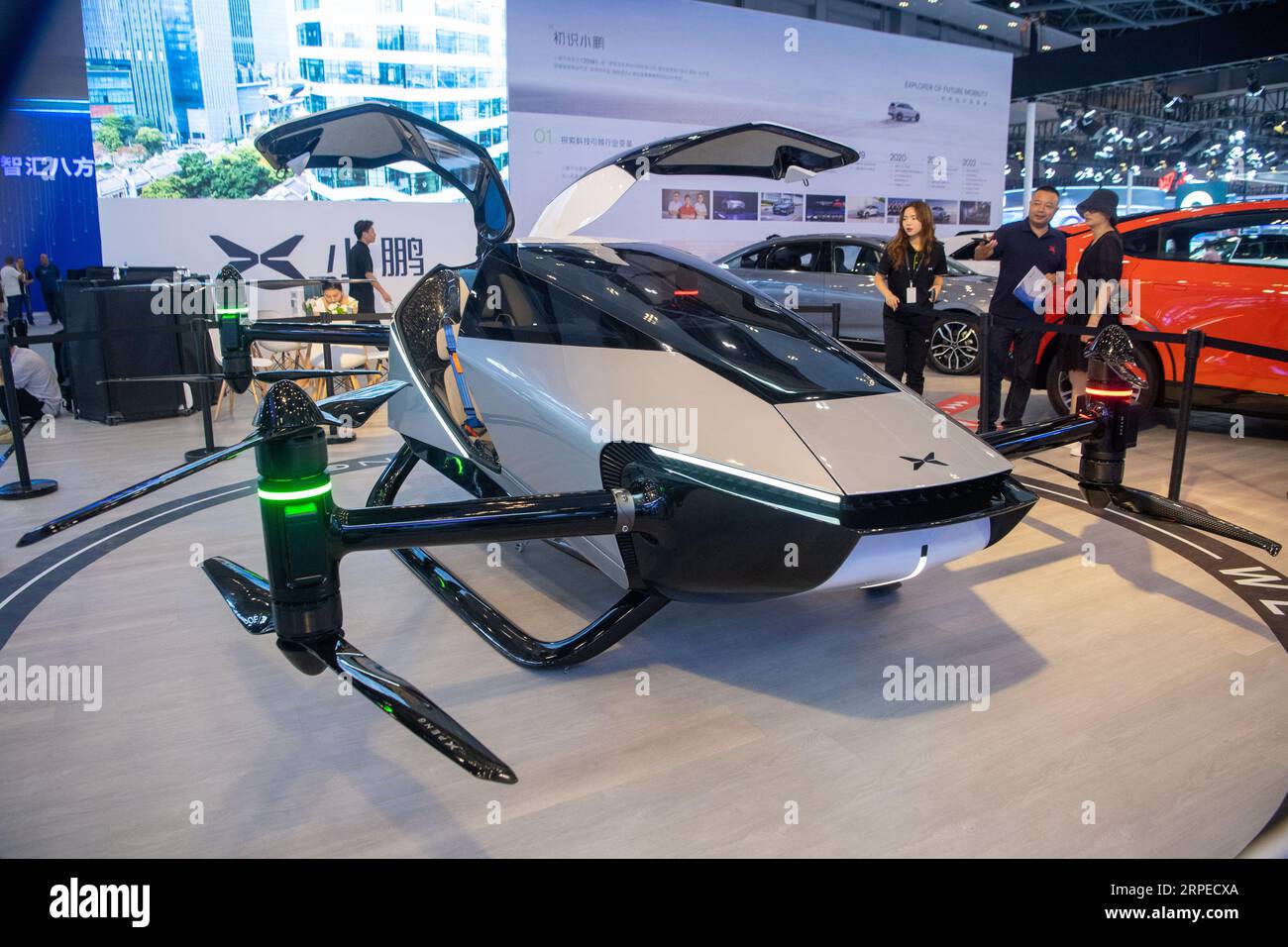 Chongqing. 4th Sep, 2023. Visitors look at a XPeng X2 flying car on ...