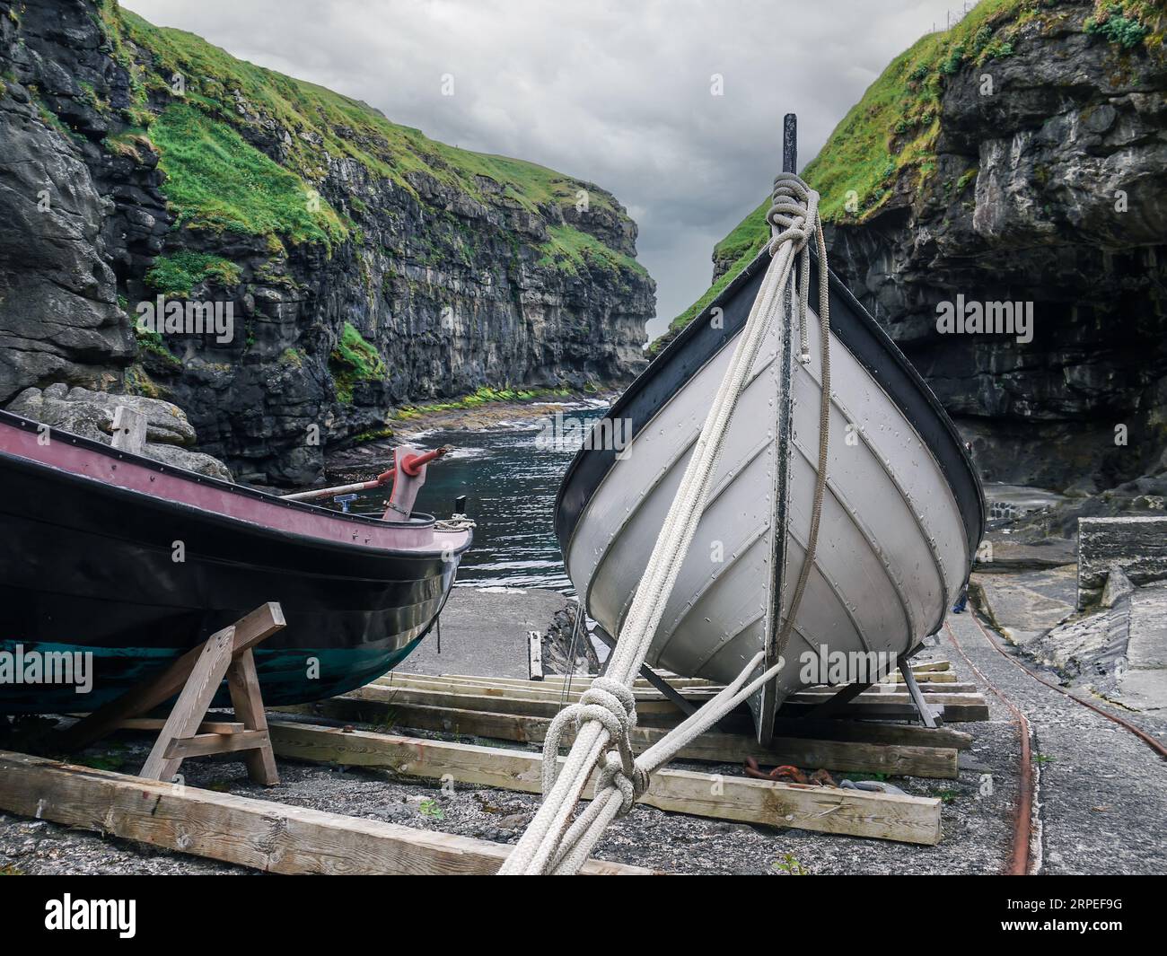 Fishing boats lashed ashore in Faroe Islands Stock Photo - Alamy