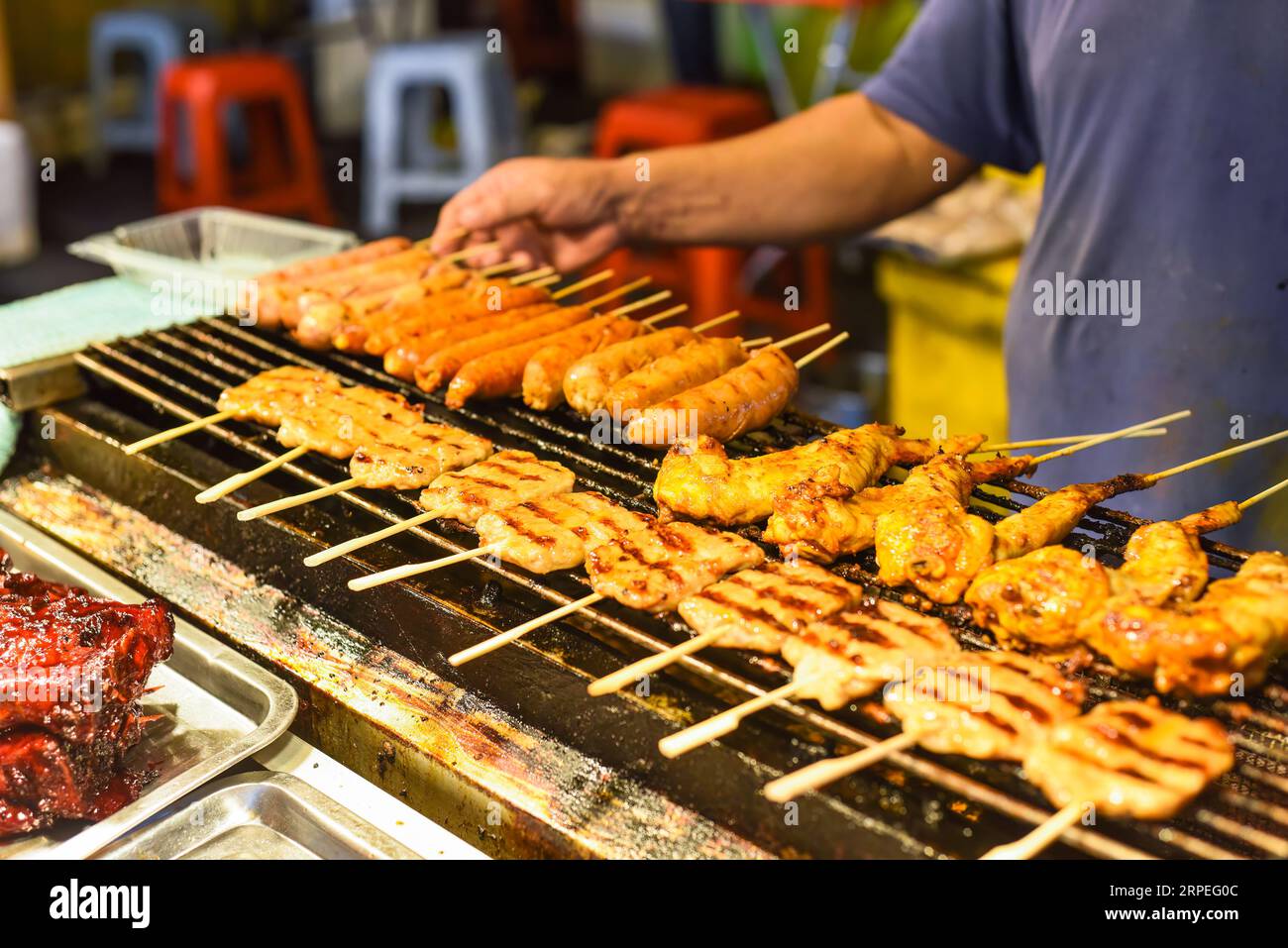Grilled chicken meat and sausages bbq in Jalan Alor street food in ...
