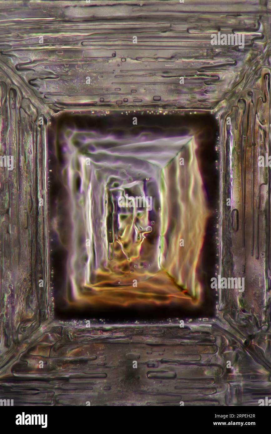 The image presents a single crystal of recrystallized salt ...