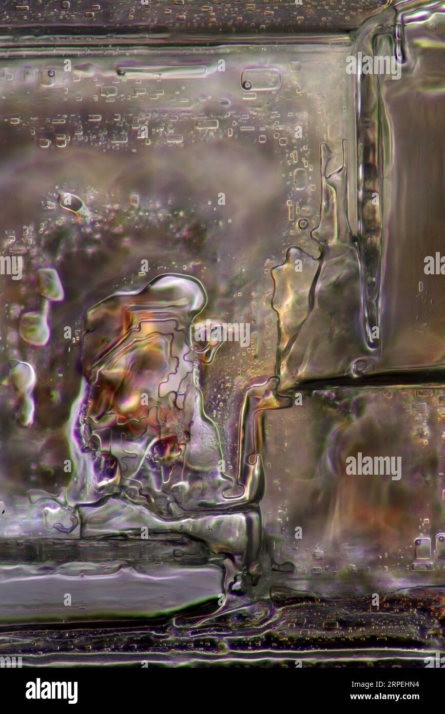 The image presents recrystallized salt, photographed through the ...