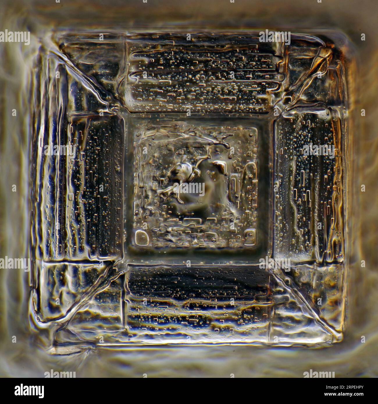The image presents a single crystal of recrystallized salt ...