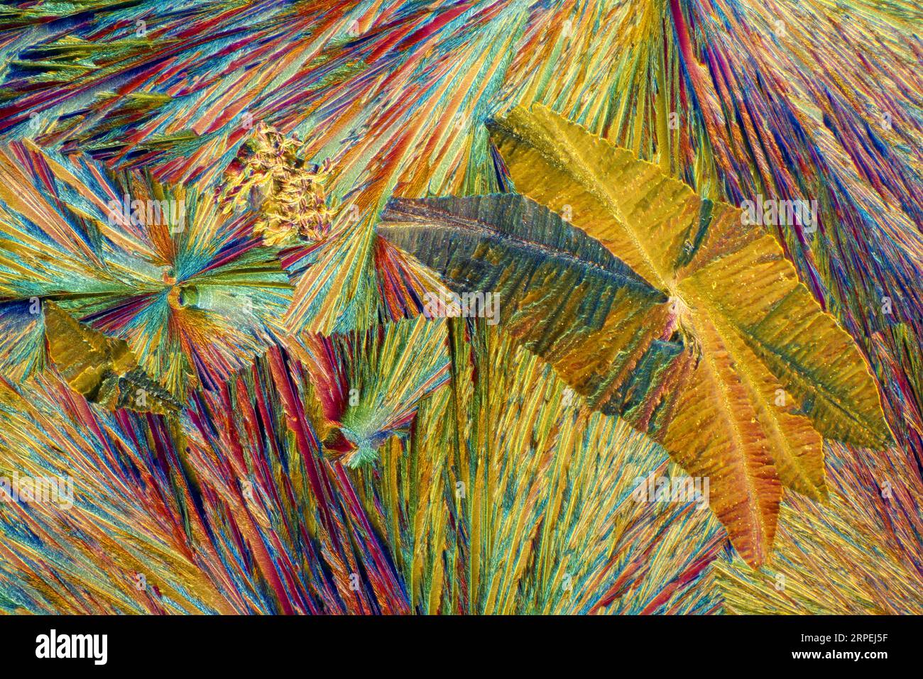 The image presents crystallized sulfur and hydroquinone, photographed ...