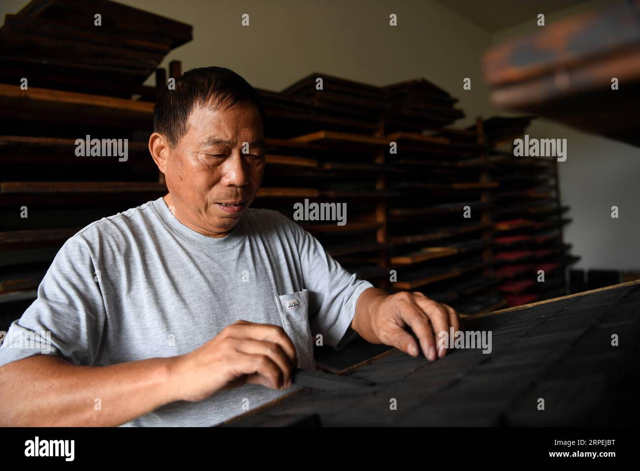 (190830) -- HUANGSHAN, Aug. 30, 2019 -- Wu Chenglin checks air-cured Huizhou inksticks in the ...