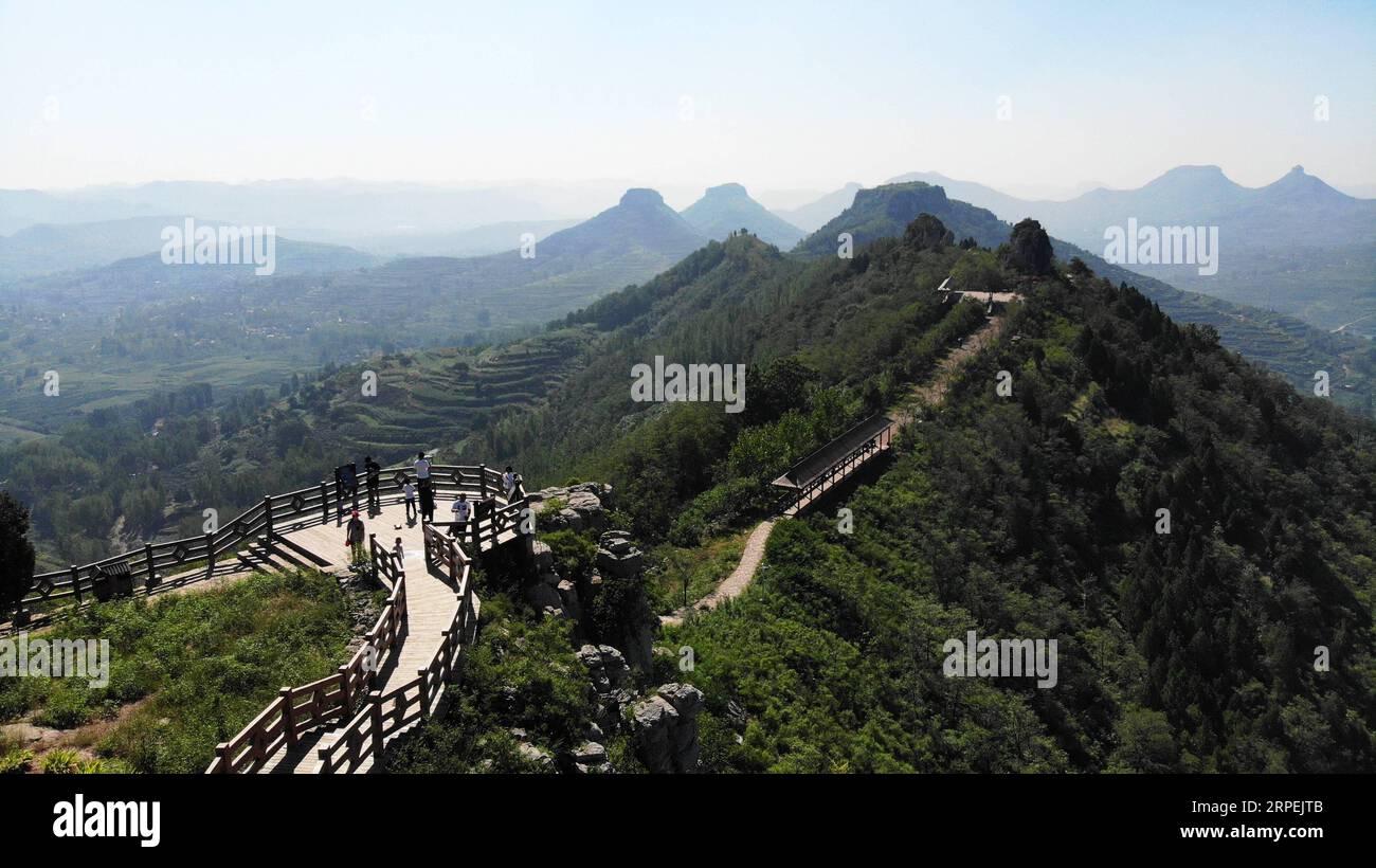 (190830) -- MENGYIN, Aug. 30, 2019 -- Aerial photo shows tourists ...