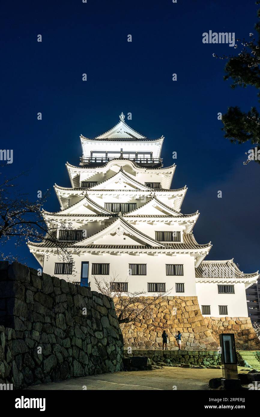 Night time view of the illuminated keep of Fukuyama castle in Japan ...
