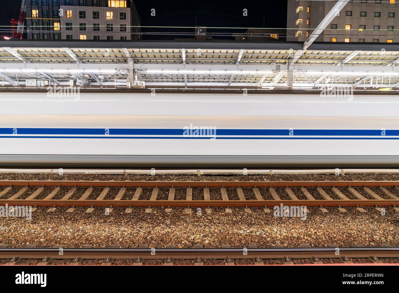 A japanese Nozomi shinkansen train passing through Fukuyama station at ...