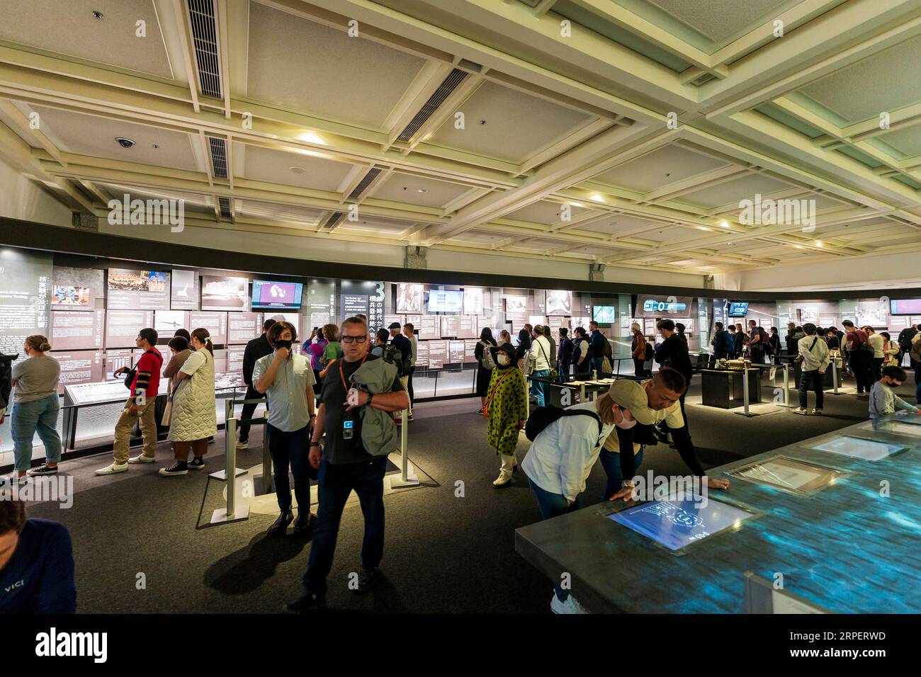 Interior shot, people viewing exhibits in the media table room ...