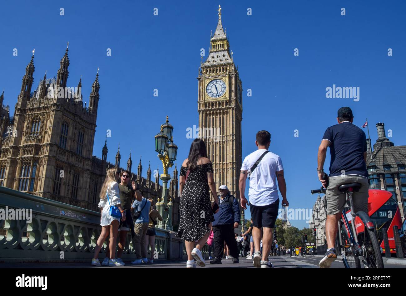 London, UK. 4th September 2023. People walk along Westminster Bridge ...