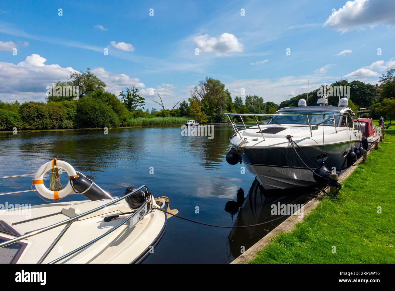 Pleasure boats moored on the River Yare at Bramerton Common in the ...