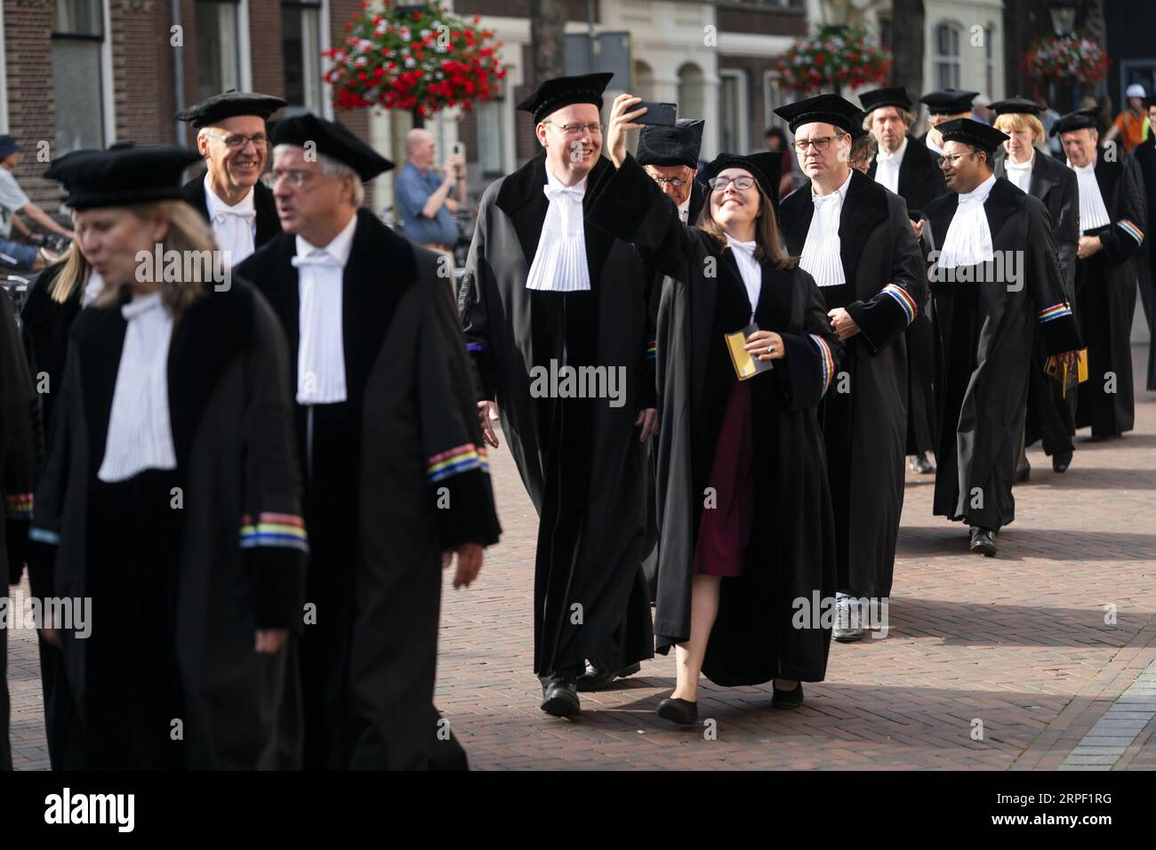 UTRECHT - Professors walk in gowns through the city center of Utrecht ...