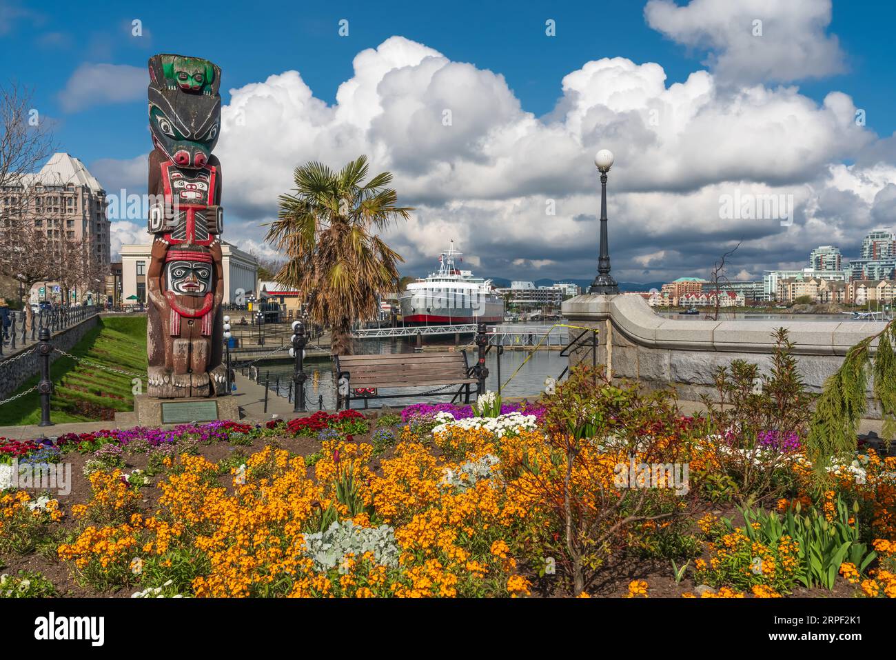 A totem pole along the waterfront of Victoria, Vancouver Island ...