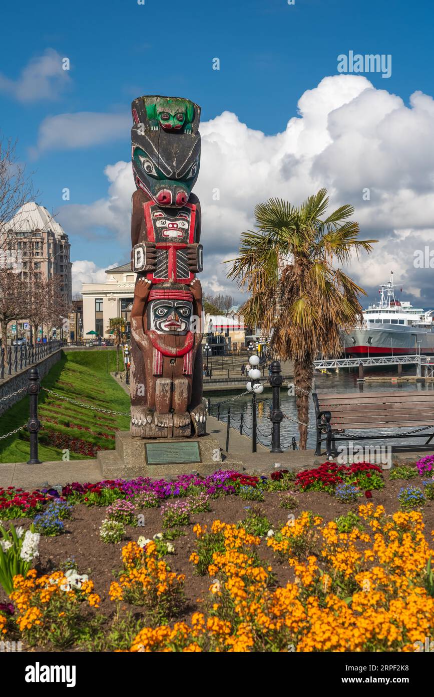 A totem pole along the waterfront of Victoria, Vancouver Island ...