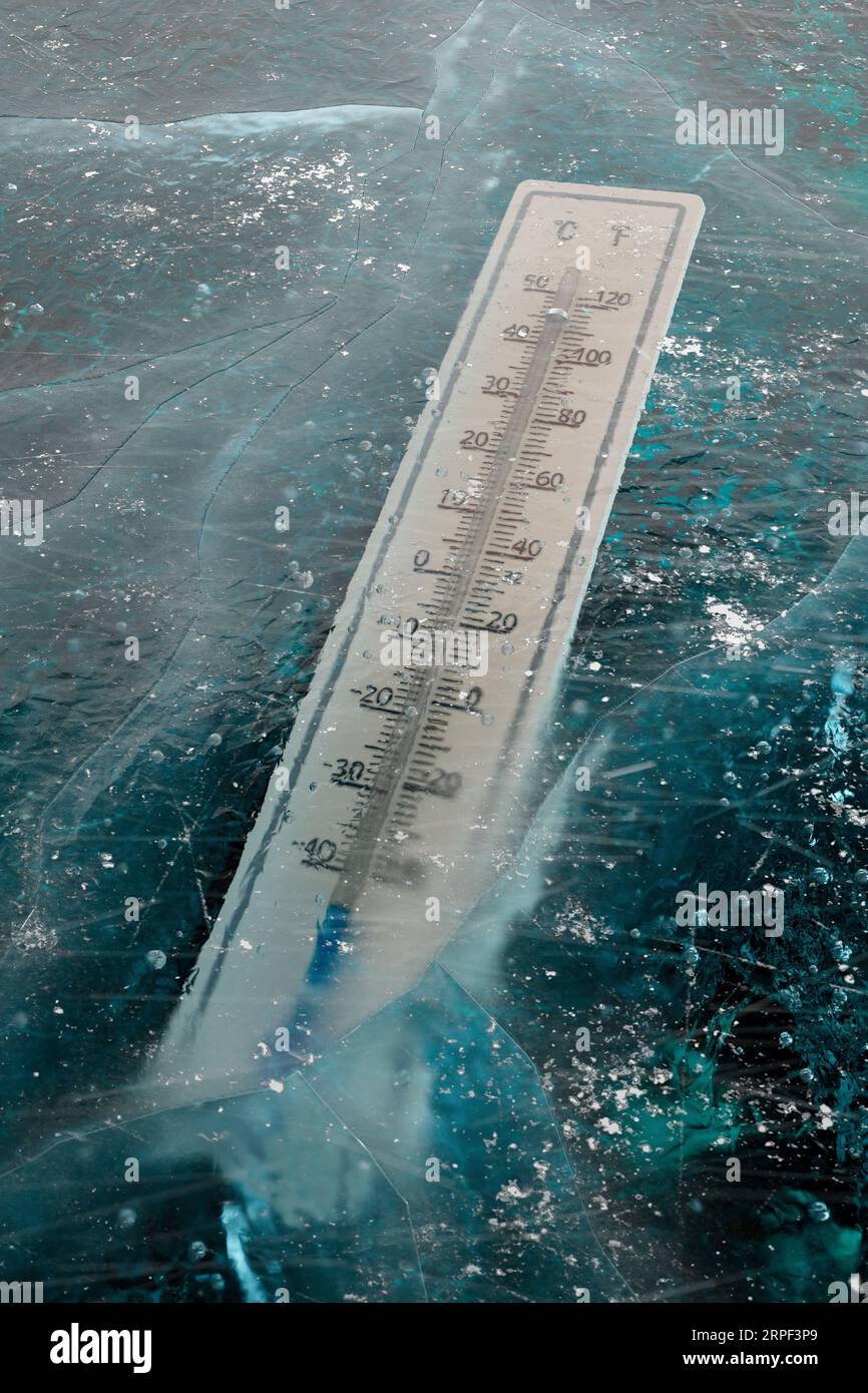 The thermometer trapped in the thick ice. Extremely low freezing cold ...
