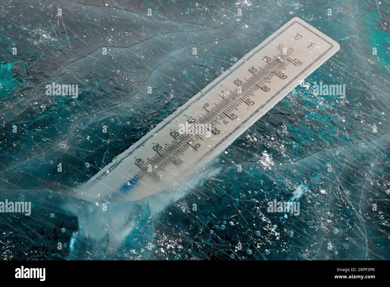 The thermometer trapped in the thick ice. Extremely low freezing cold ...