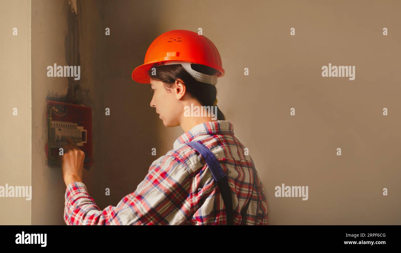 electrician builder engineer check automatic switches in fuse box ...