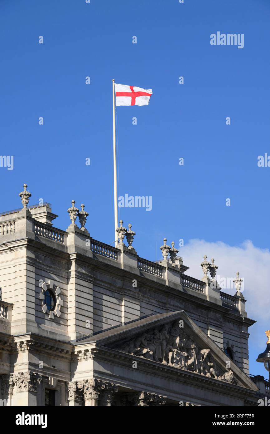 A Saint George's Cross flag being flown over, the office of HM Revenue ...