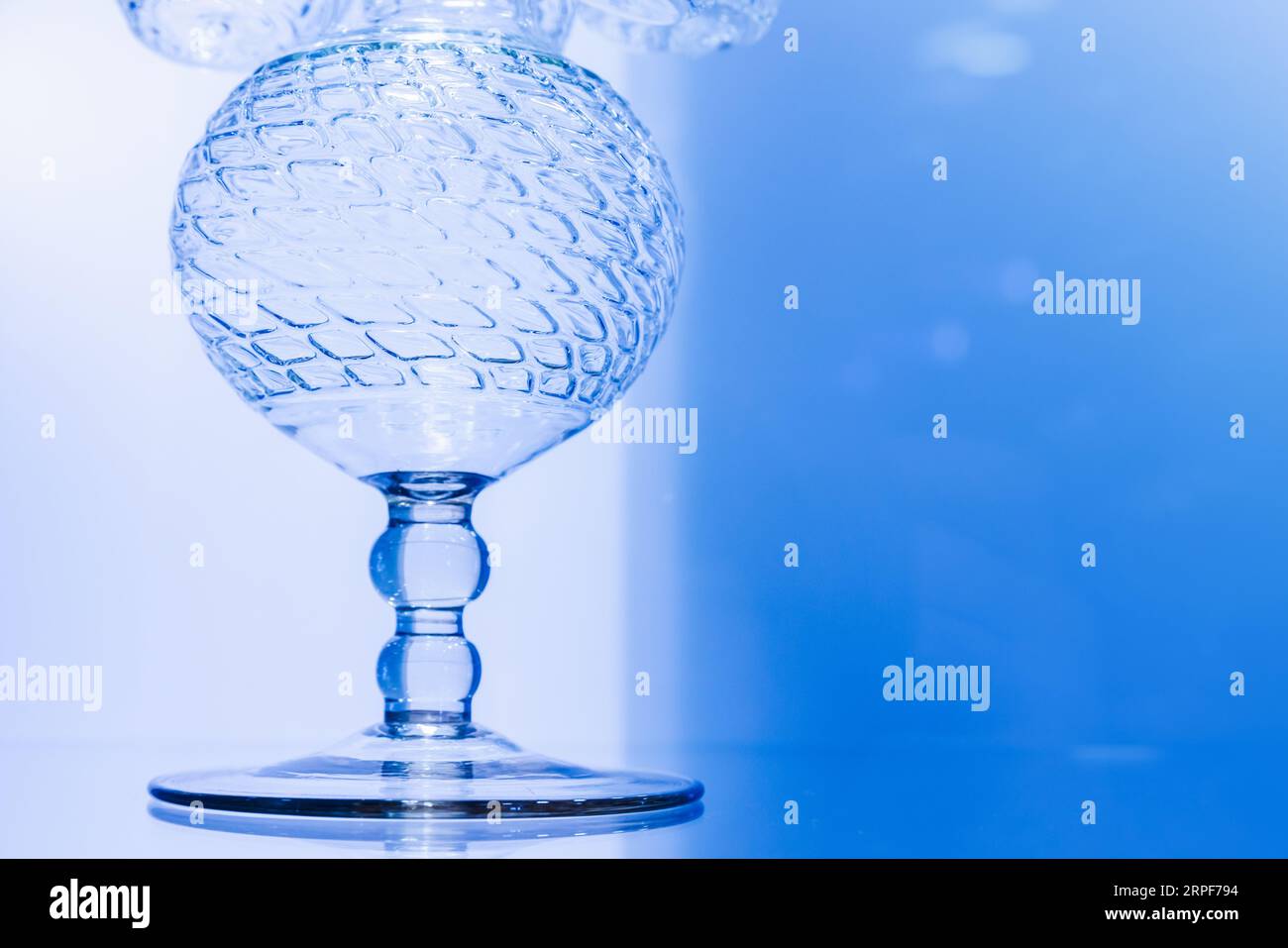 Abstract glass installation, transparent empty spherical vase close up ...