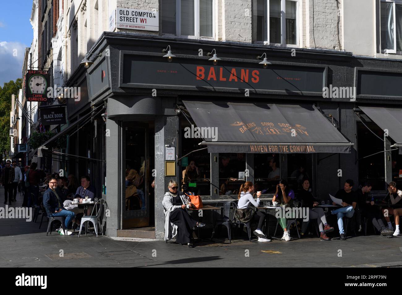 Customs sat at outside tables, Balans Cafe, 34 Old Compton Street, Soho ...