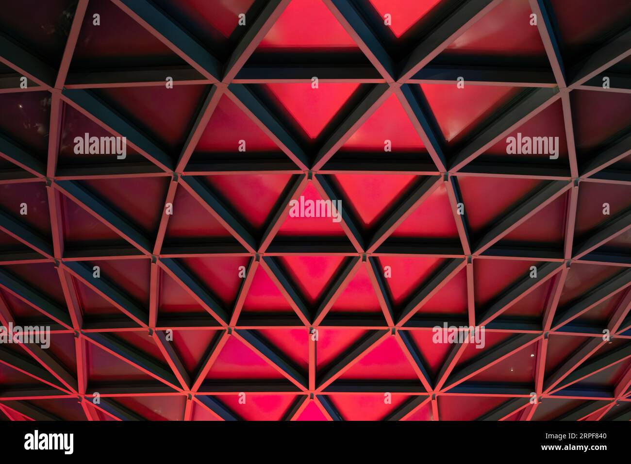 Abstract vortex architectural pattern of red triangles Stock Photo - Alamy