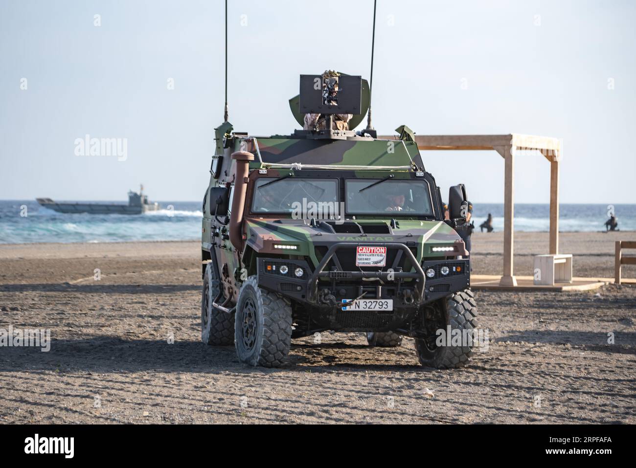 Vamtac military vehicle landed on the beach during maneuvers for the ...