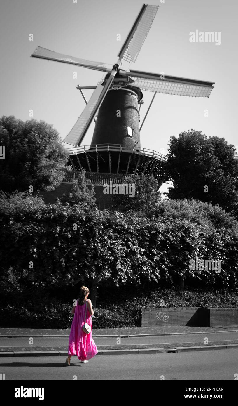 Woerden, Netherlands - June 24 2003: women in pink dress and the town's ...