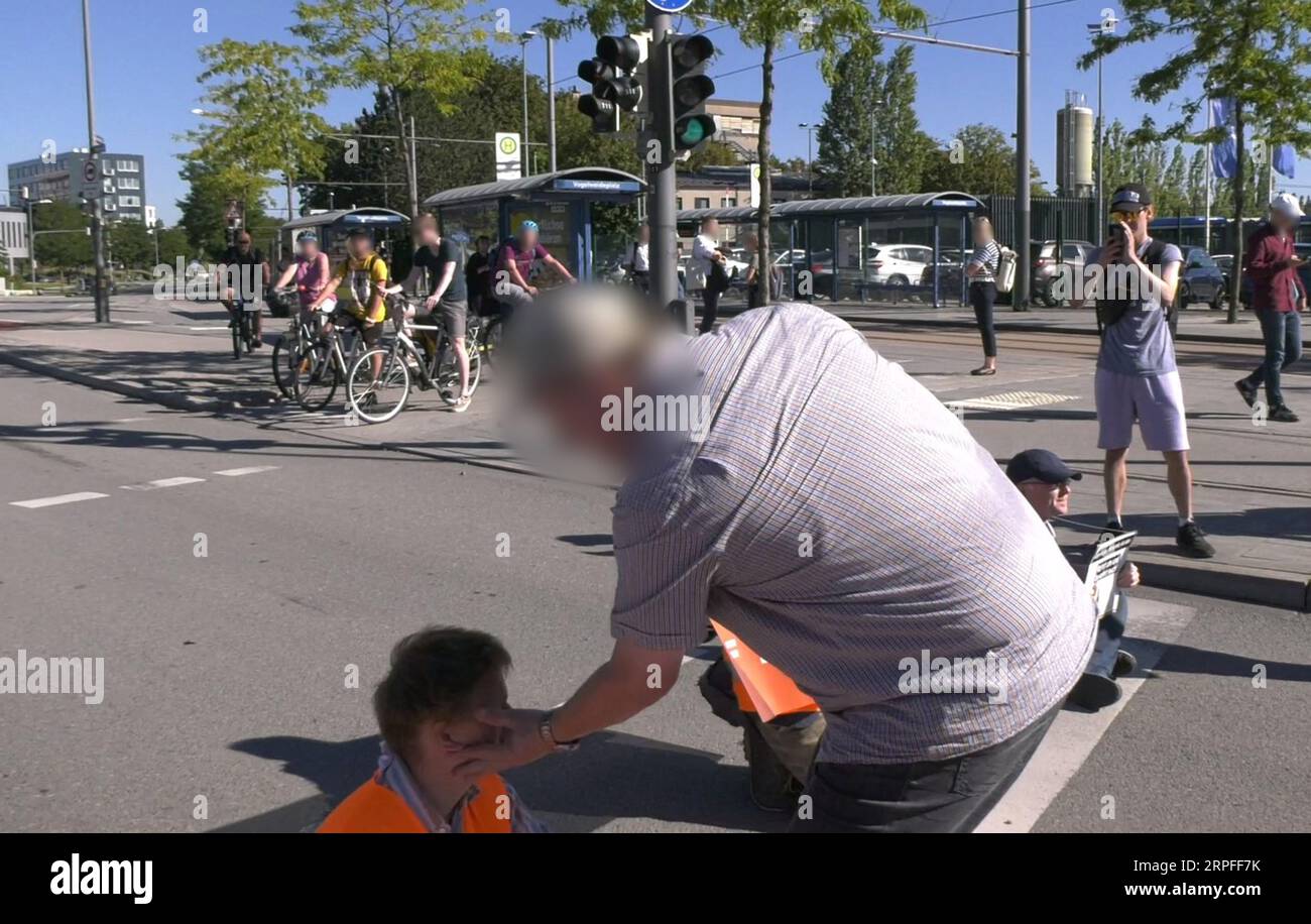 Munich, Germany. 04th Sep, 2023. A car driver slaps an activist of the ...