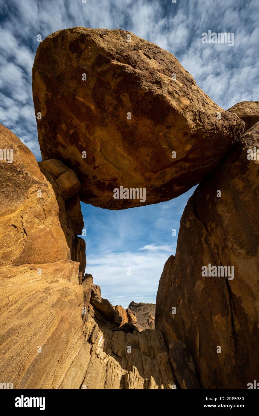 Looking Through Balanced Rock With Clouds Streaking Overhead in Big ...
