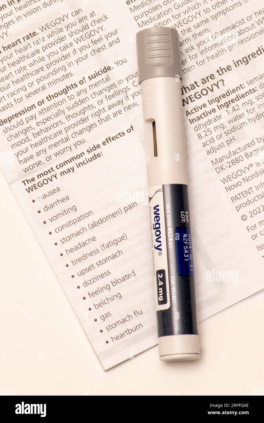 Still life of Wegovy an injectable prescription weight loss medicine with side effects sheet ...