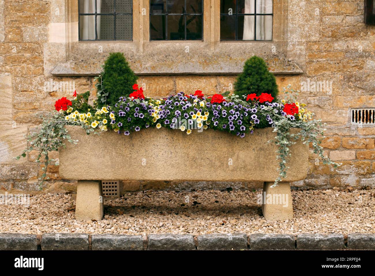 Stone planters in the Cotswold village of Lower Slaughter, England UK ...