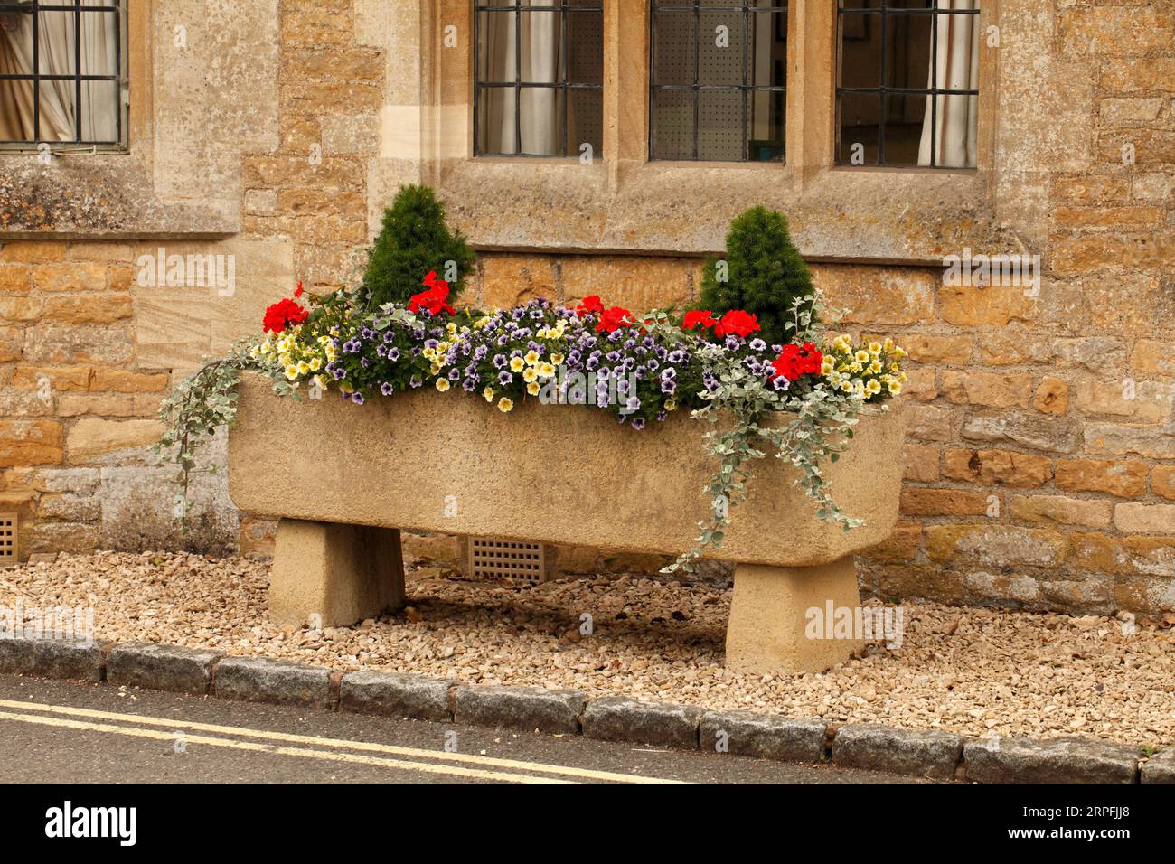 Stone planters in the Cotswold village of Lower Slaughter, England UK ...