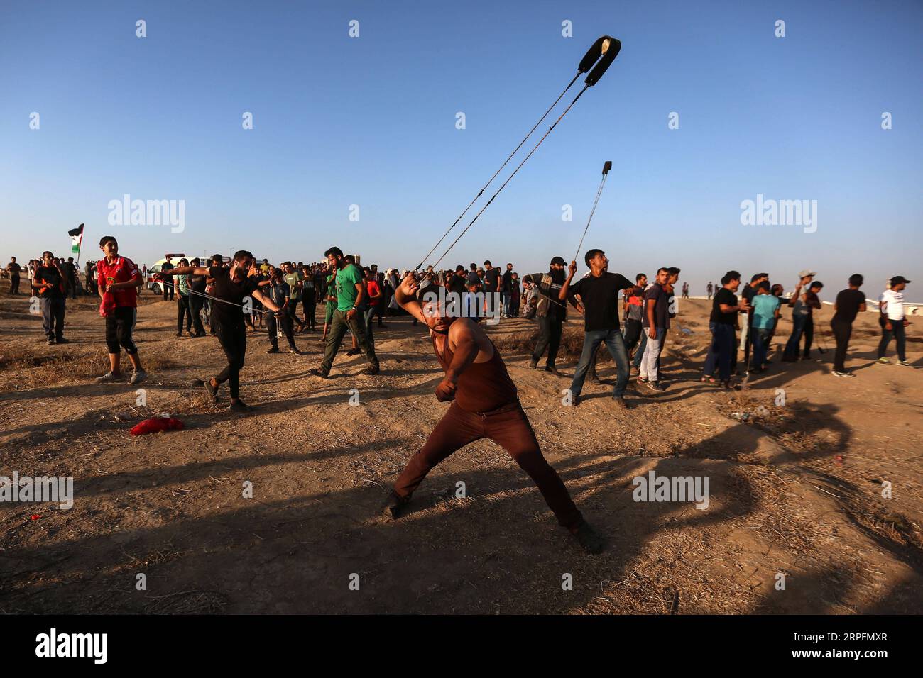 Palestinian man uses slingshot palestinian hi-res stock photography and ...