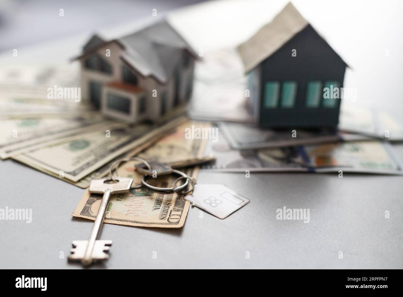 Investment. model house and money Stock Photo - Alamy