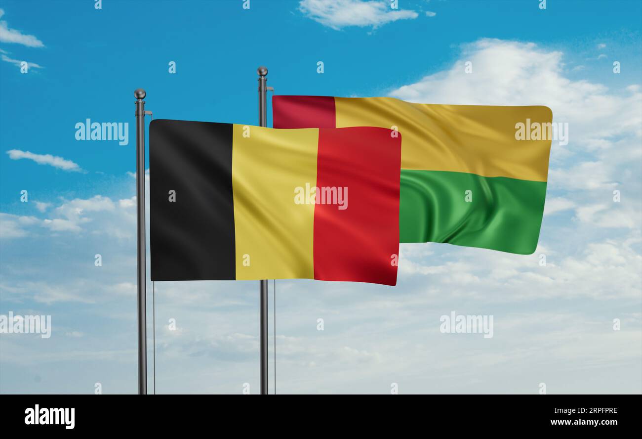Guinea-Bissau flag and Belgium flag waving together on blue sky, two ...