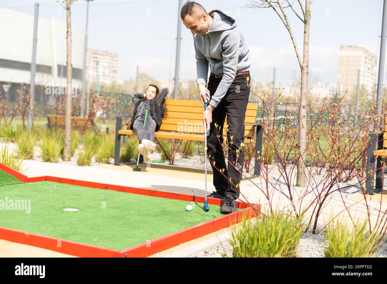 Young man miniature golf hi-res stock photography and images - Alamy