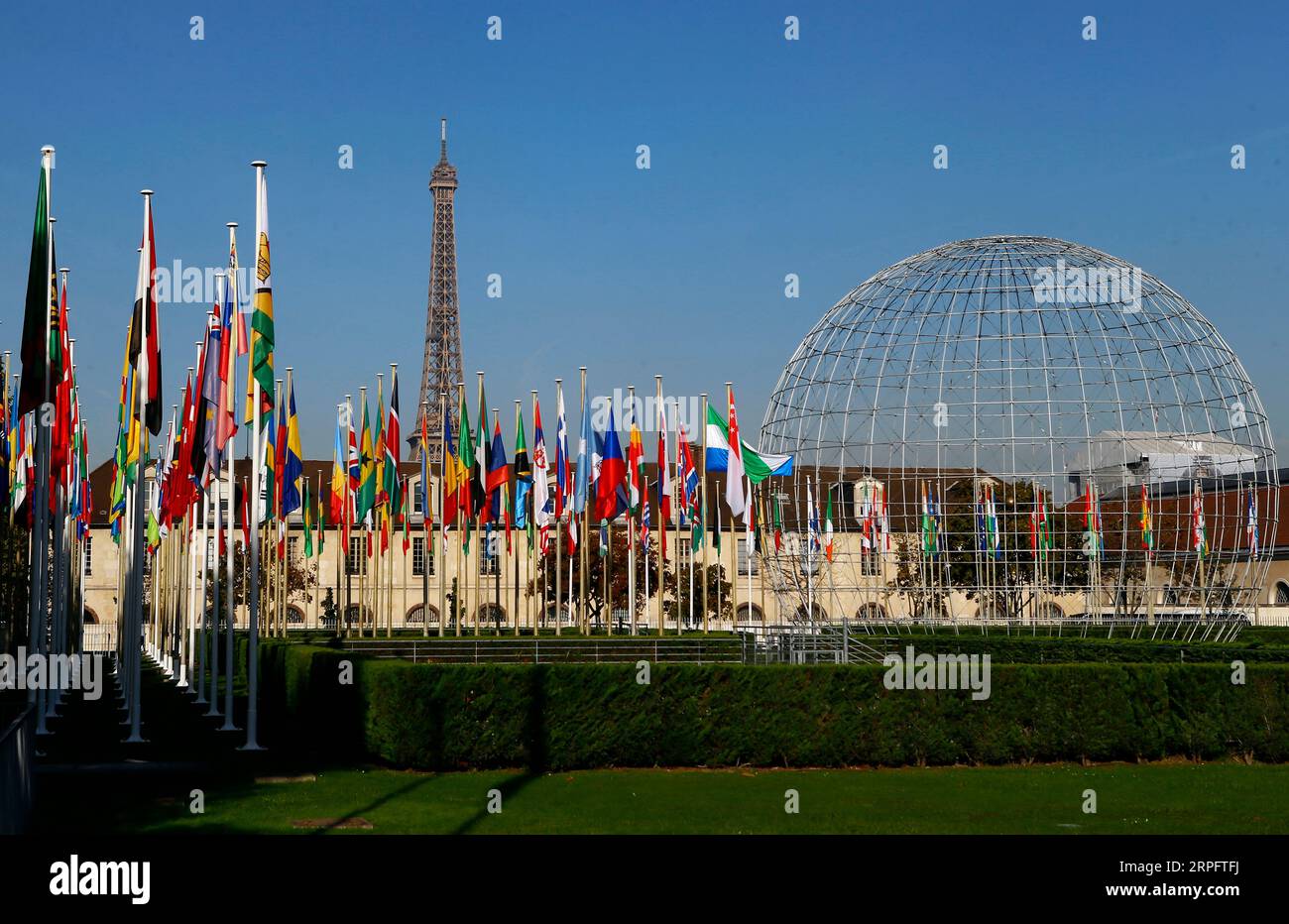 FILE - The Eiffel Tower, country flags and the Dome are seen from the ...