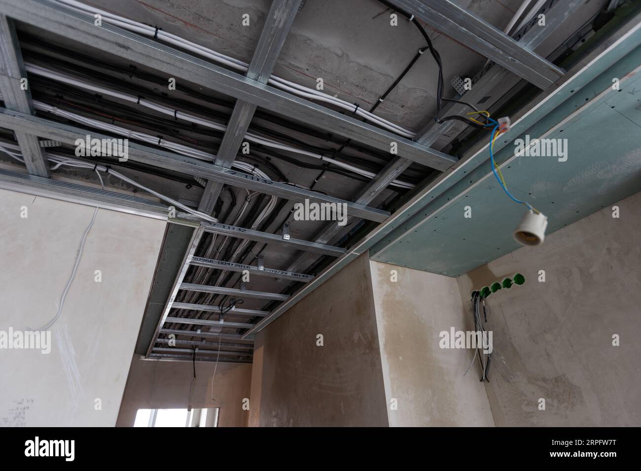 Man assembles profile metal frame for plasterboard ceilings Stock Photo ...