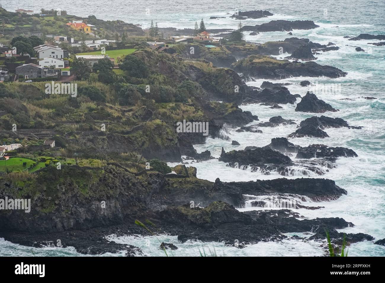 Rough seas pound the rocky coastline on the Azorean Island of Sao ...