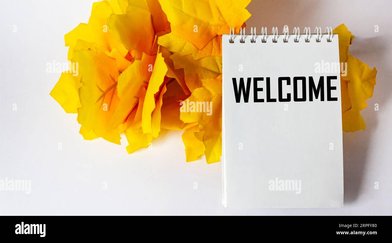 Welcome - the concept of the word on a notepad and a white background ...