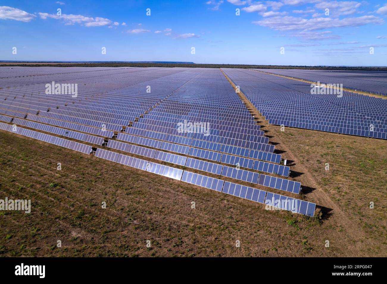 Aerial view of solar panels at a modern solar power plant that ...