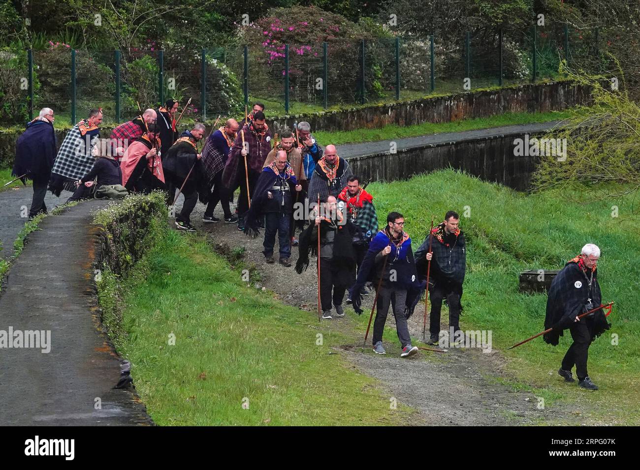 Roman Catholic pilgrims called a Romeiros, gather for a sermon in mist ...